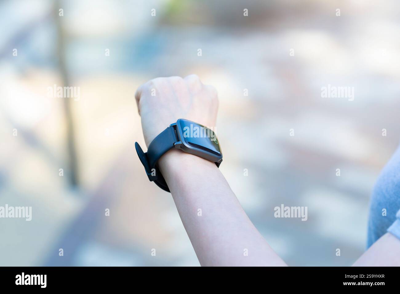 Smartwatch worn on left wrist Stock Photo - Alamy