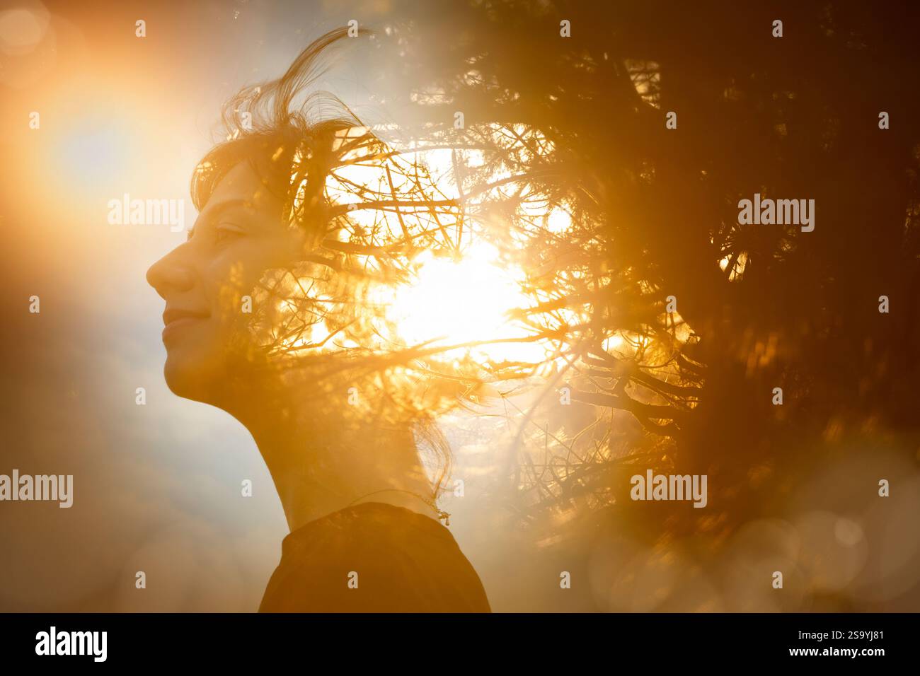 Composite CG of woman in profile and sunlight filtering through trees ...