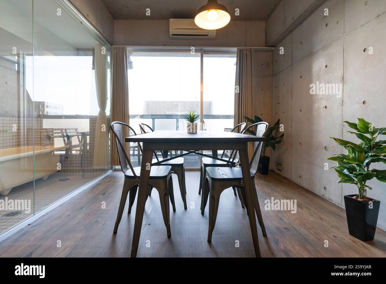 Table by the window in the living room Stock Photo - Alamy