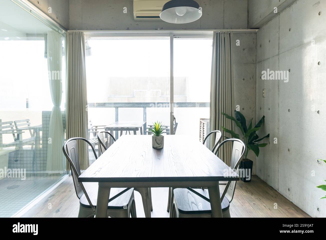 Table by the window in the living room Stock Photo - Alamy
