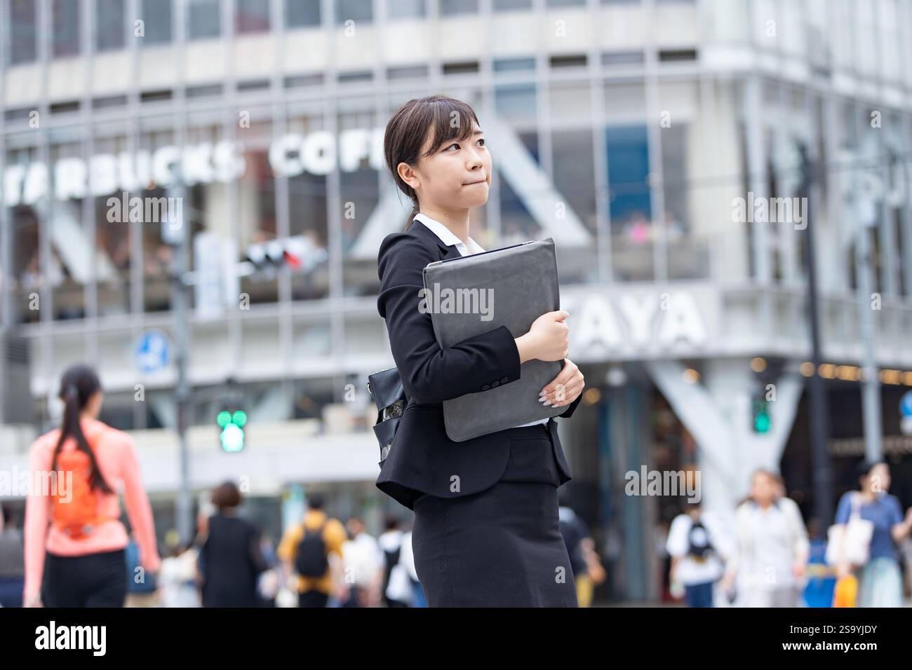 Newcomer commuting to work, image of job search Stock Photo - Alamy