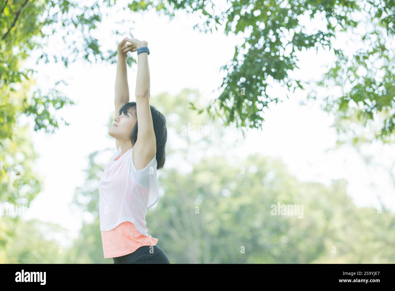 Woman taking a deep breath during exercise Stock Photo - Alamy