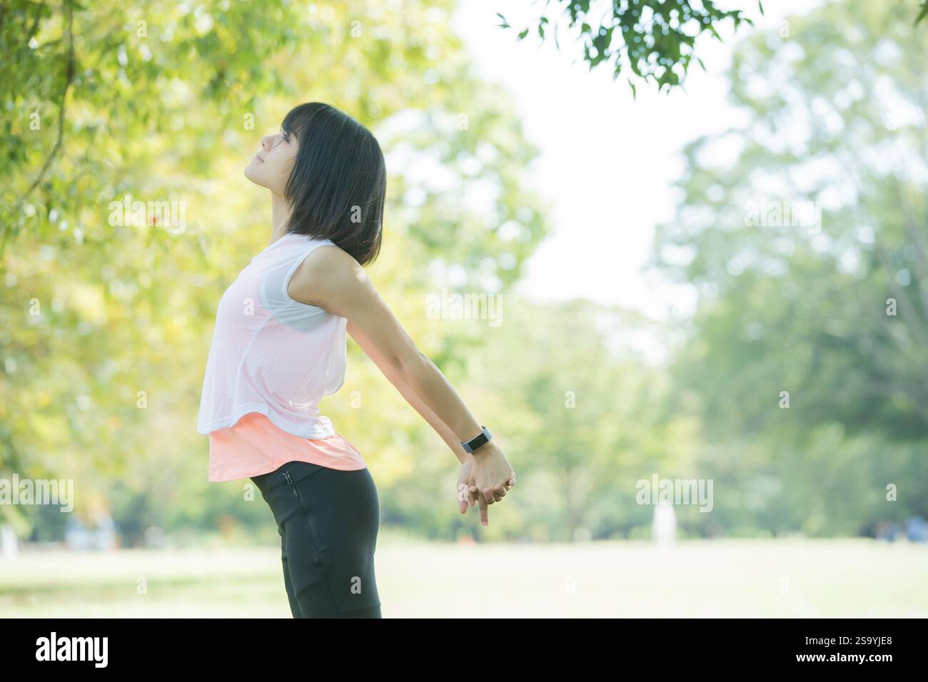 Woman taking a deep breath during exercise Stock Photo - Alamy