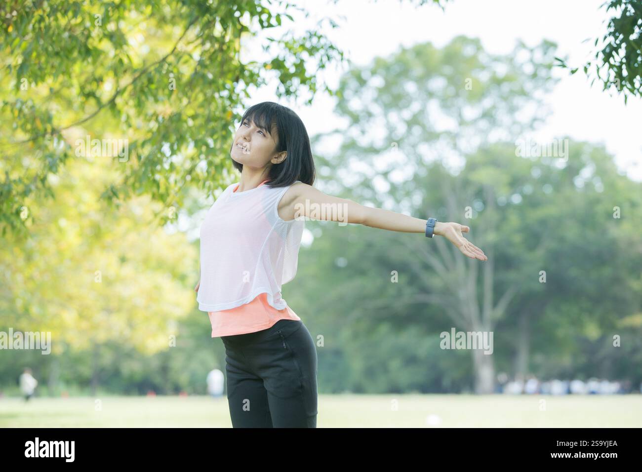 Woman taking a deep breath during exercise Stock Photo - Alamy