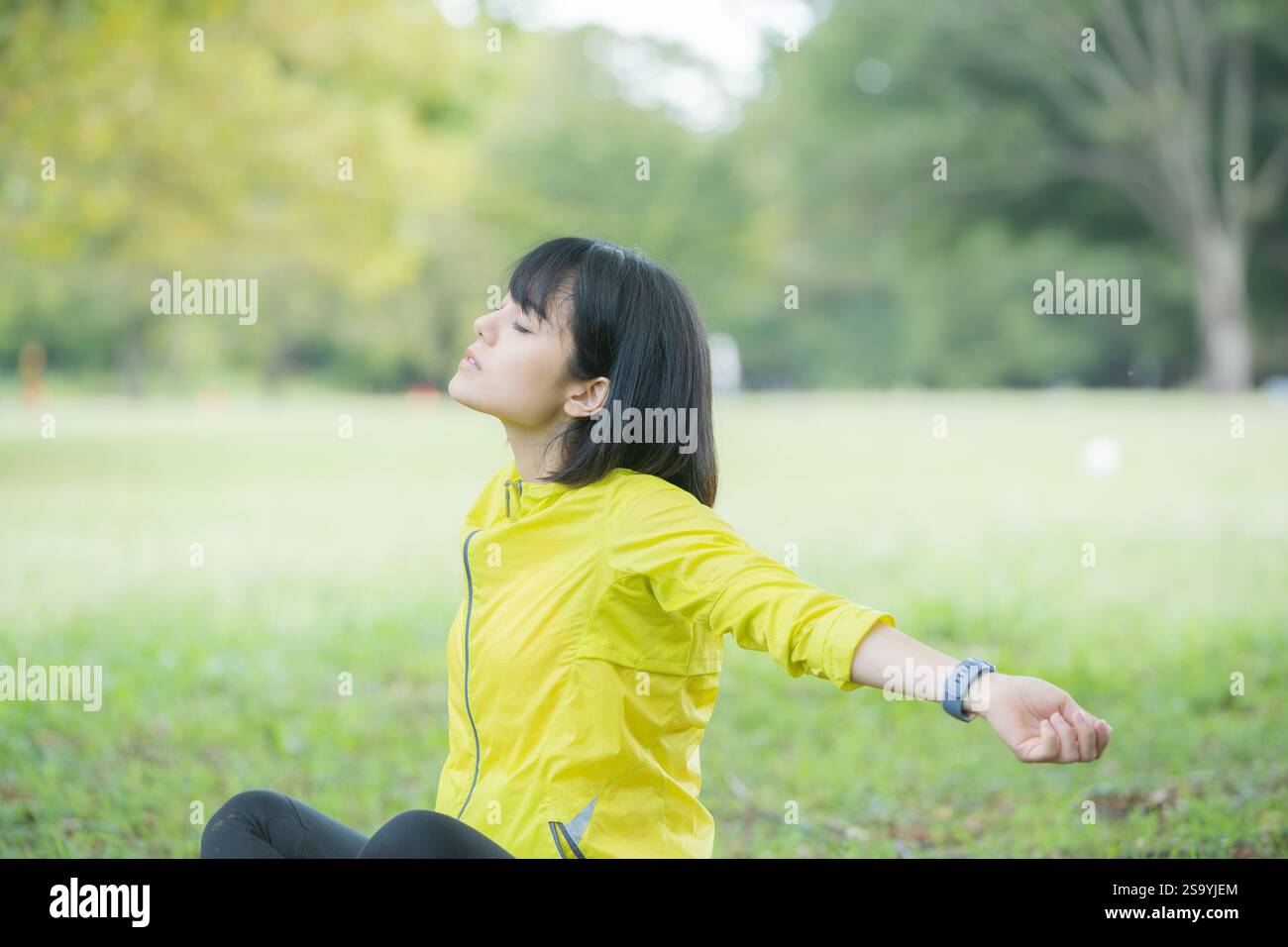 Woman taking a deep breath during exercise Stock Photo - Alamy