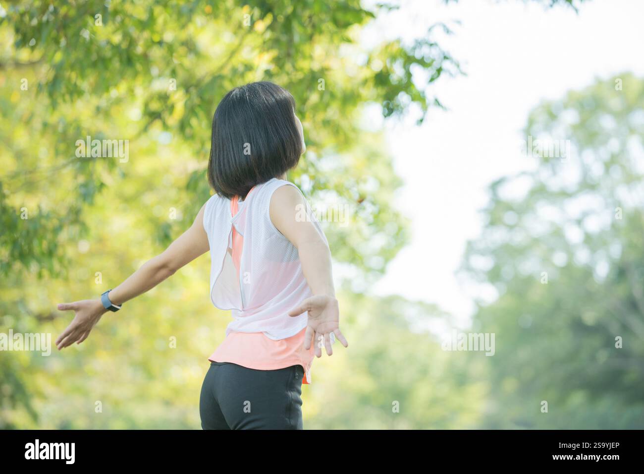 Woman taking a deep breath during exercise Stock Photo - Alamy