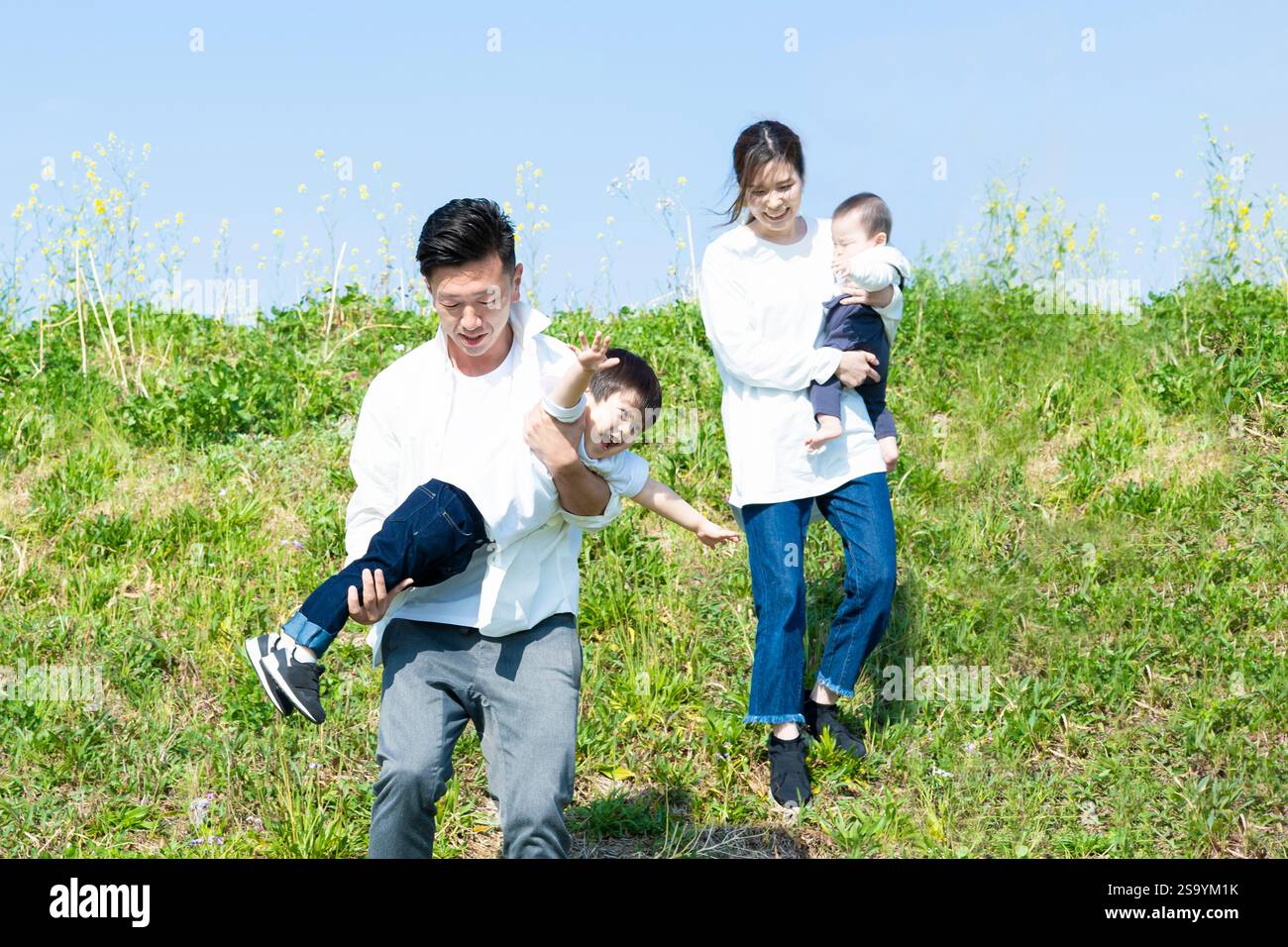 Parent and child strolling playfully with smiles on their faces Stock ...