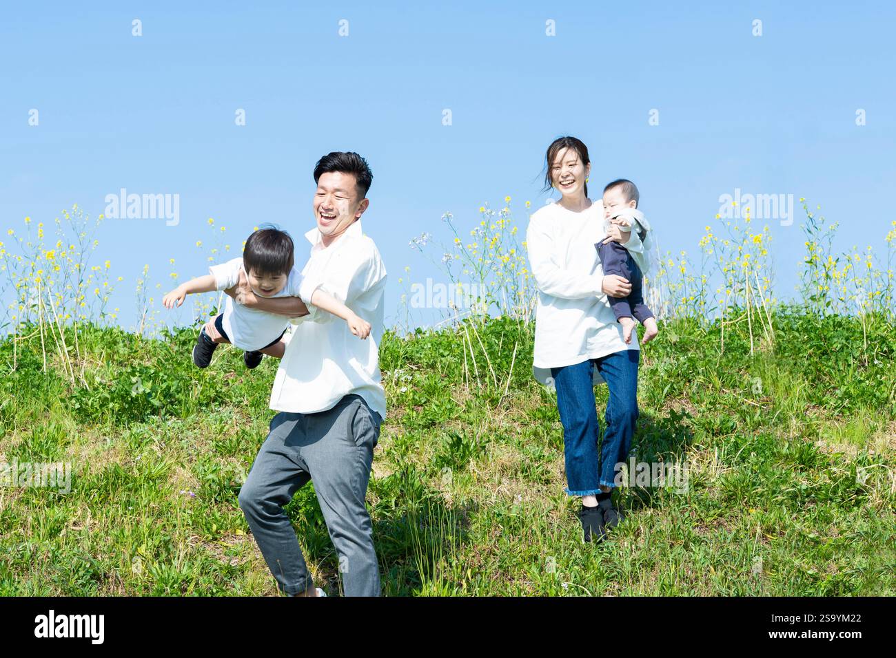 Parent and child strolling playfully with smiles on their faces Stock ...