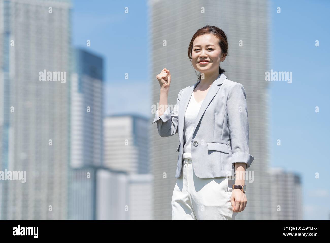 Businesswoman cheering with her guts out Stock Photo - Alamy