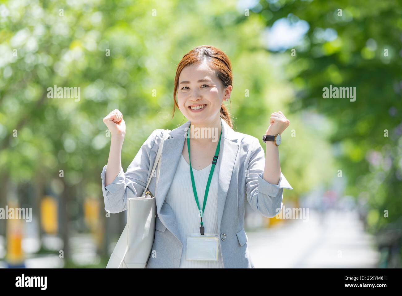 Businesswoman cheering with her guts out Stock Photo - Alamy