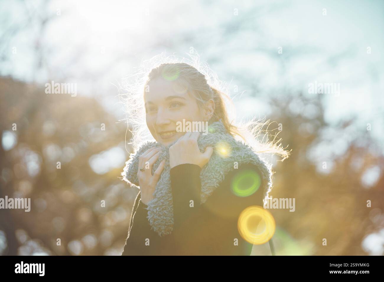 Woman walking in park (backlit Stock Photo - Alamy