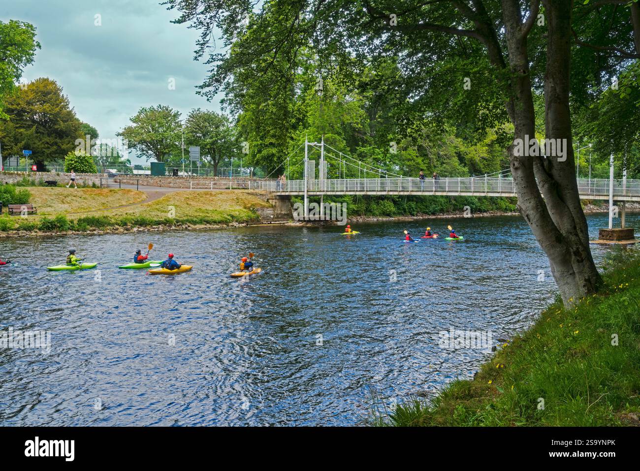 Canoes, Islands walk on banks of River Ness in Inverness, Highland ...