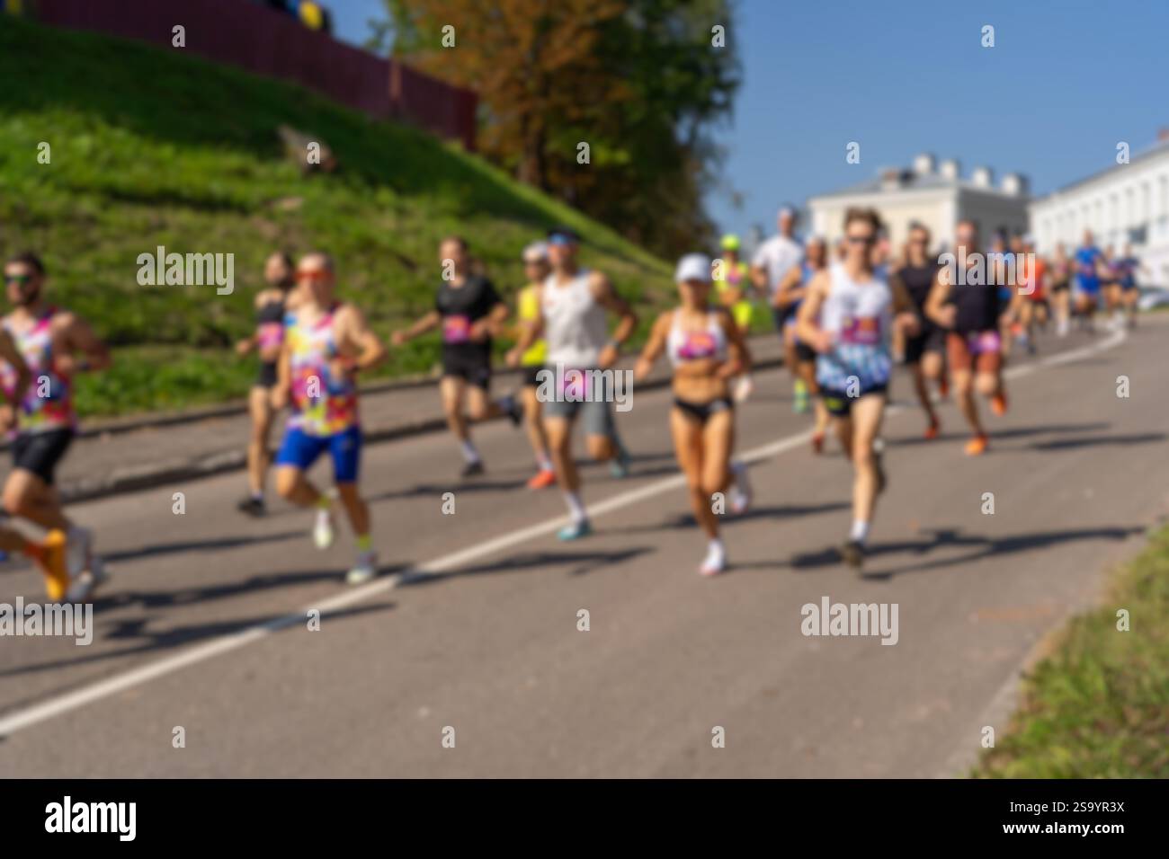 An unfocused background image of a group of athletes participating in a ...