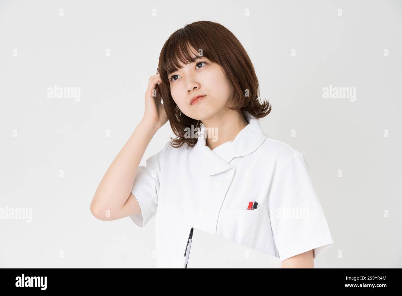 Nurse with questioning expression Stock Photo - Alamy