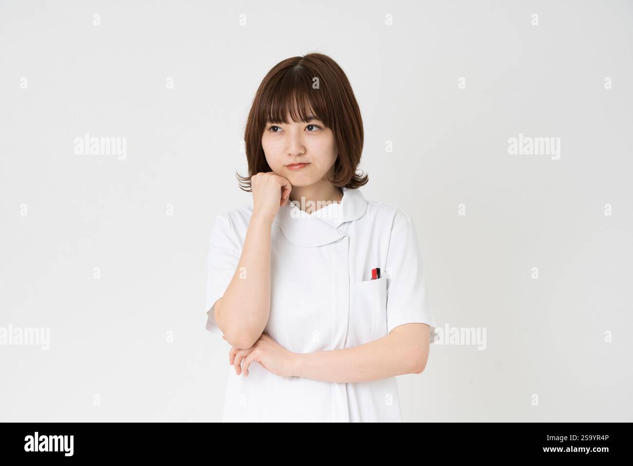 Nurse with questioning expression Stock Photo - Alamy