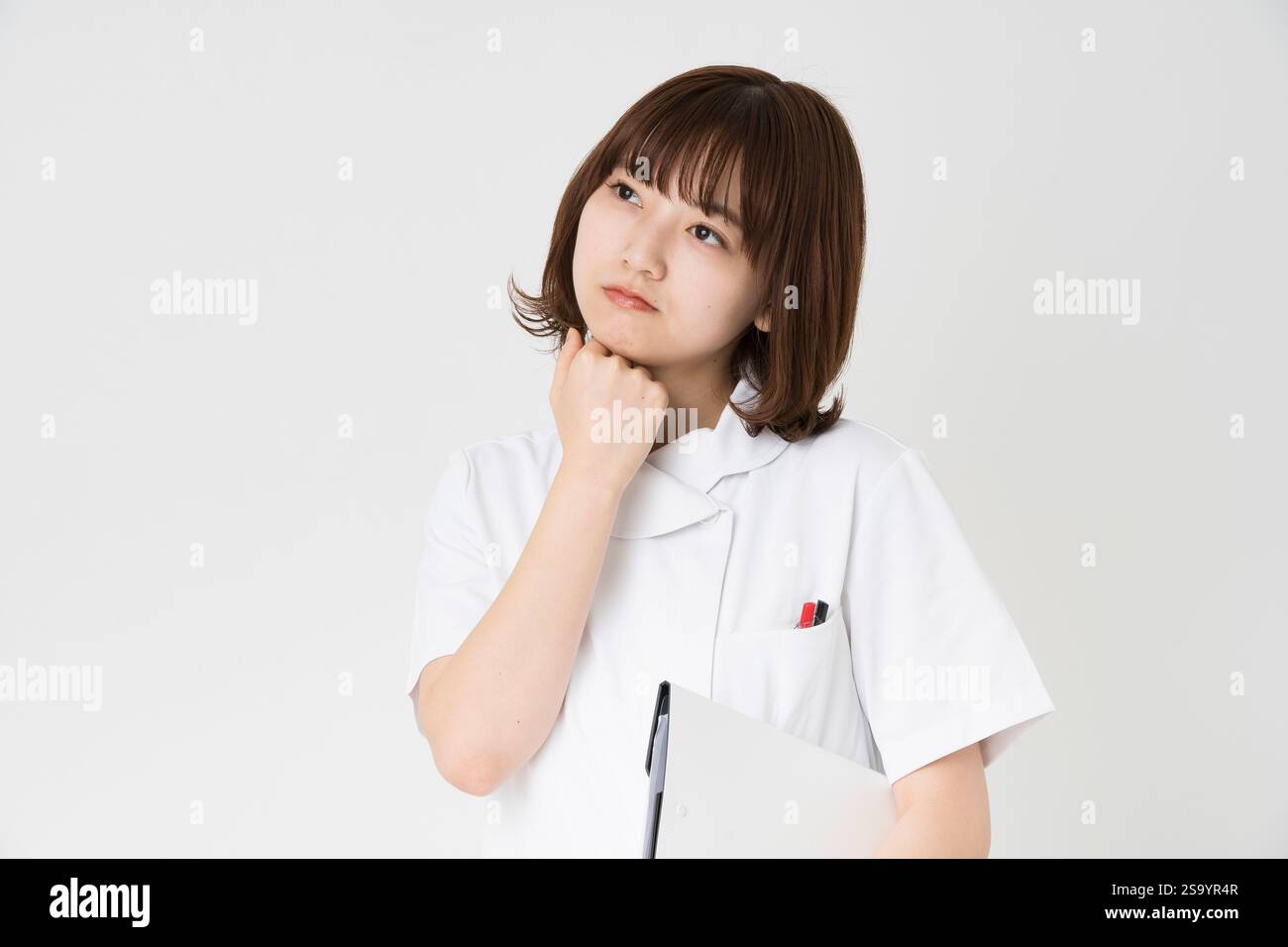 Nurse with questioning expression Stock Photo - Alamy