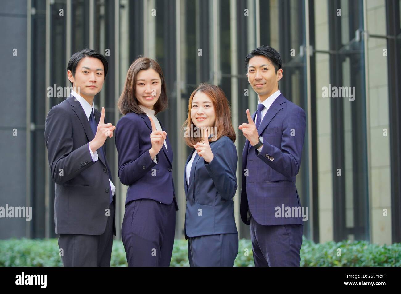 Business scene, team of four Stock Photo - Alamy