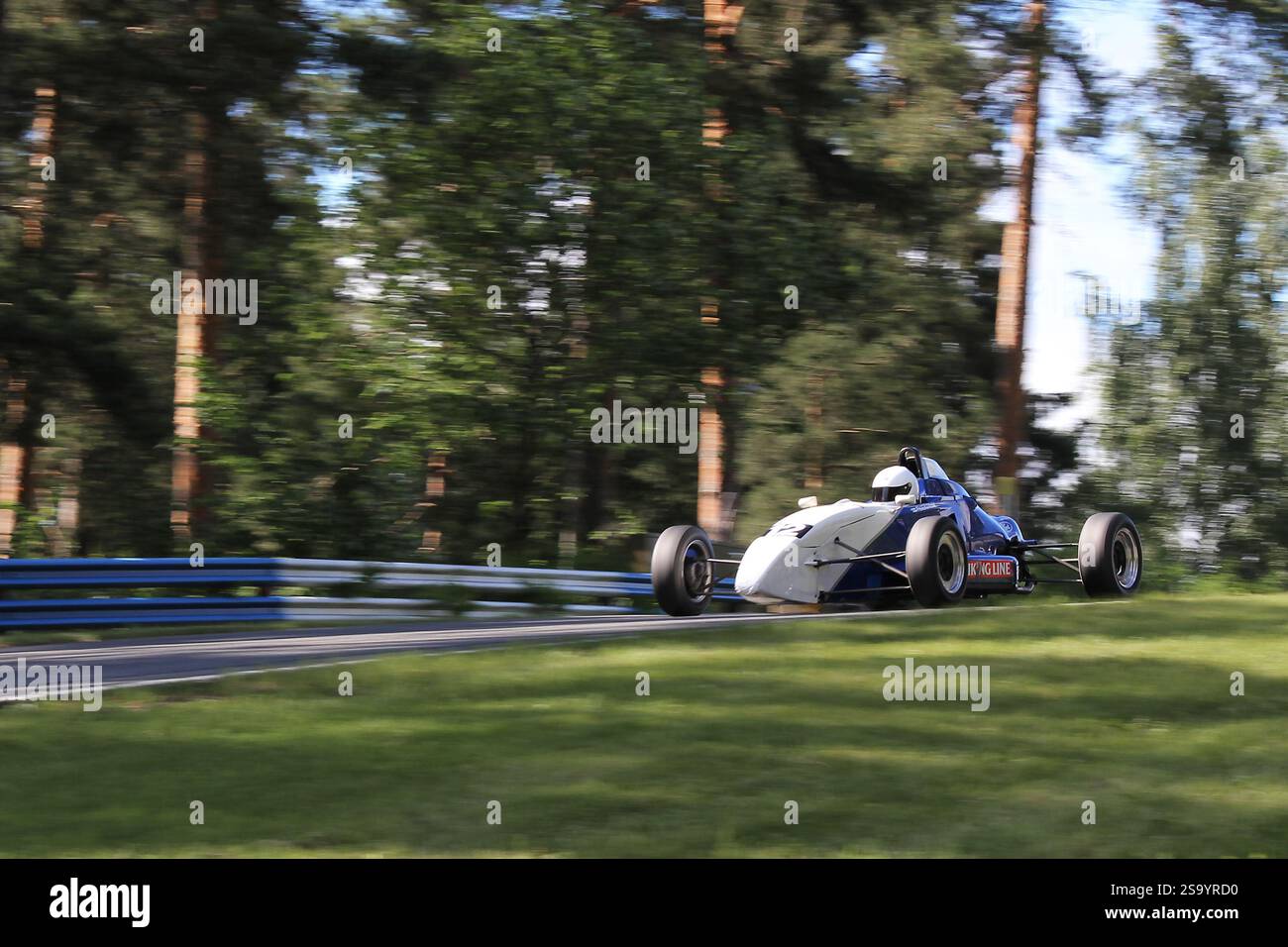 Formula racecar driving fast on racetrack at Ahvenisto race circuit in ...