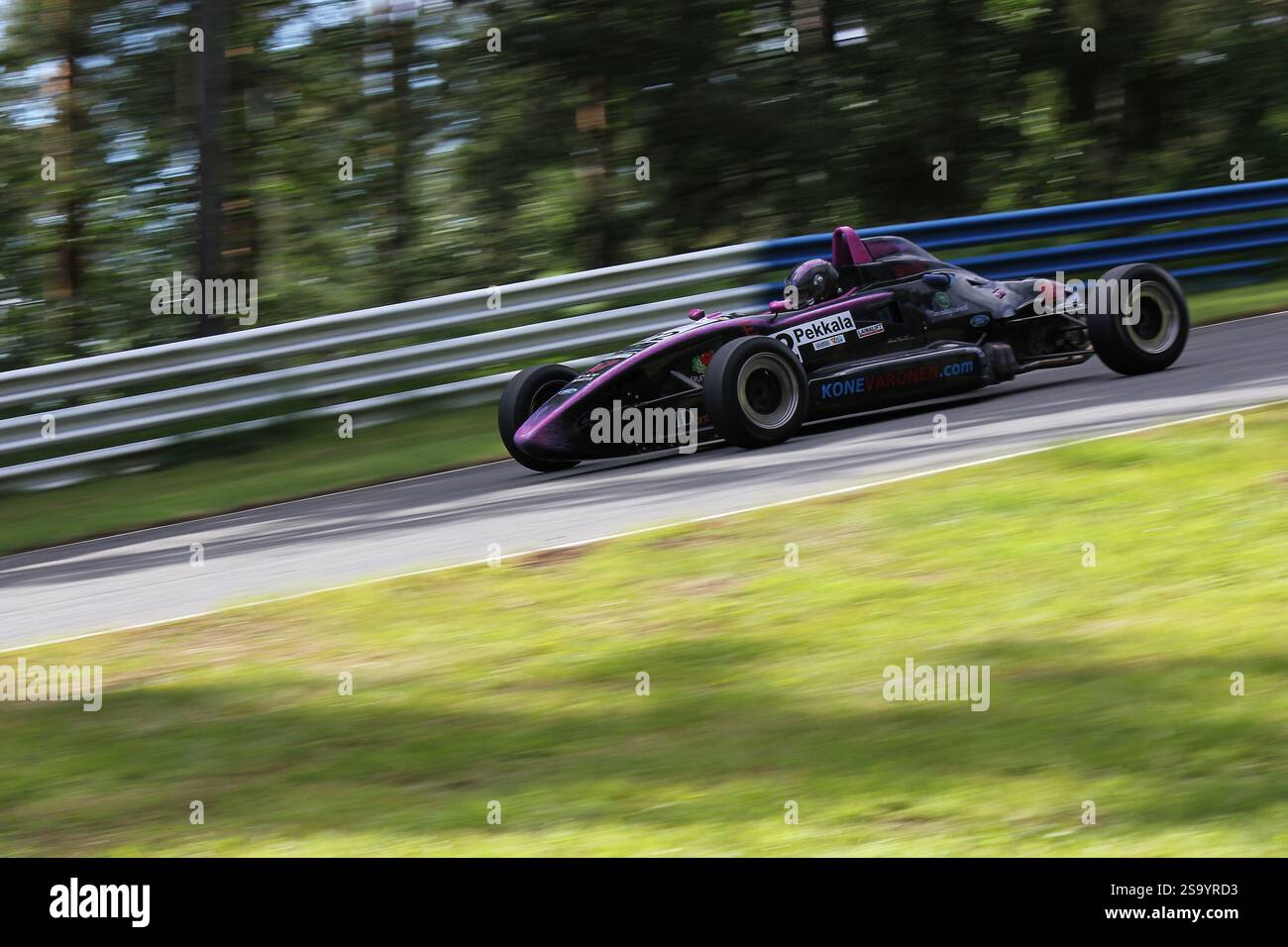 Formula racecar driving fast on racetrack at Ahvenisto race circuit in ...