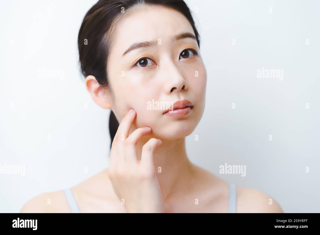 Woman concerned about skin condition Stock Photo - Alamy