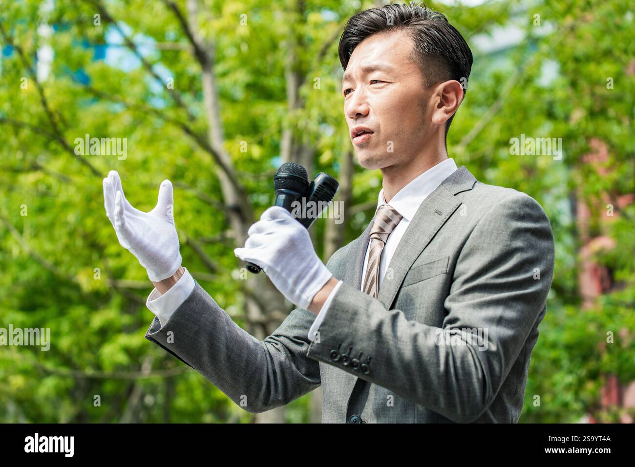 Image of election candidate speaking on the street Stock Photo - Alamy