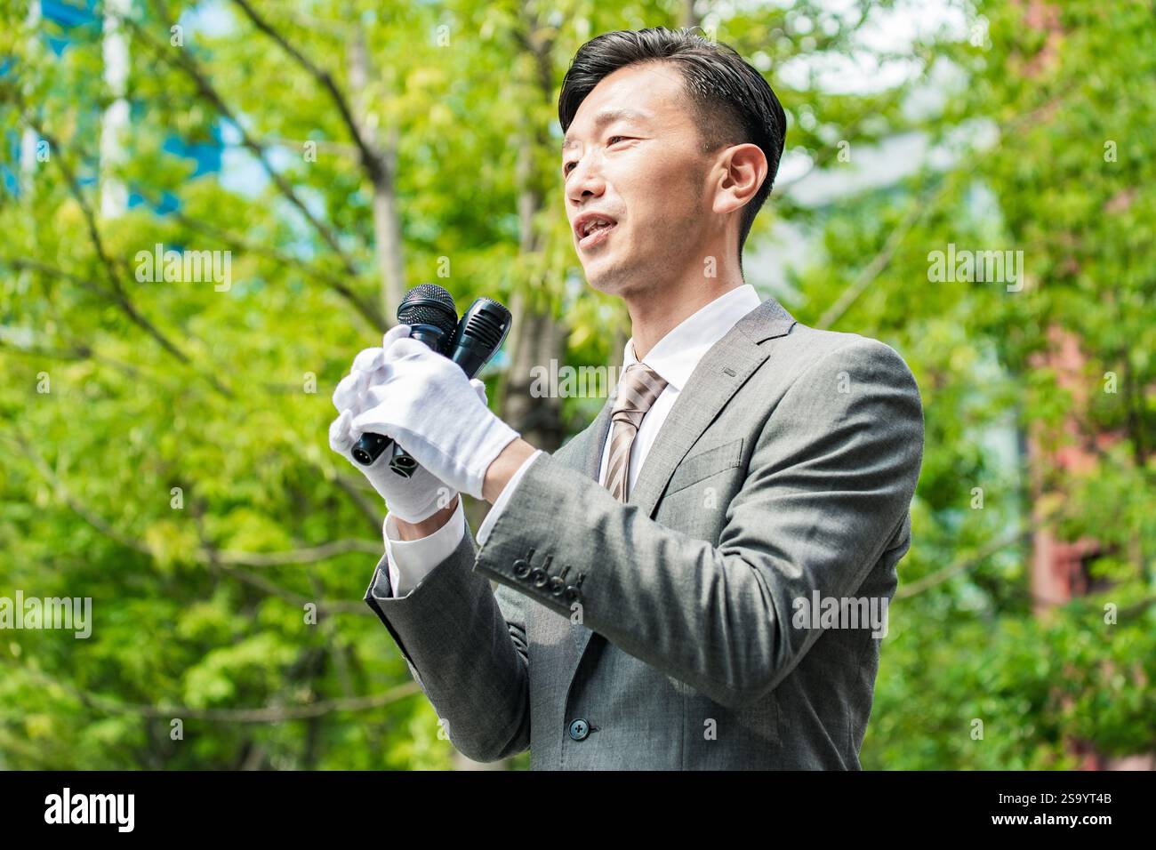 Image of election candidate speaking on the street Stock Photo - Alamy