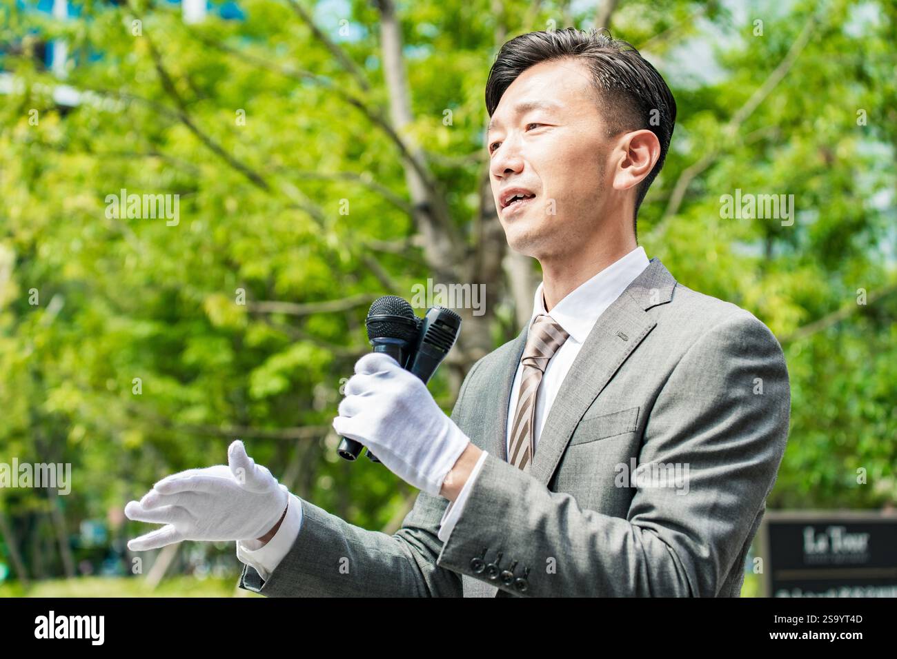 Image of election candidate speaking on the street Stock Photo - Alamy