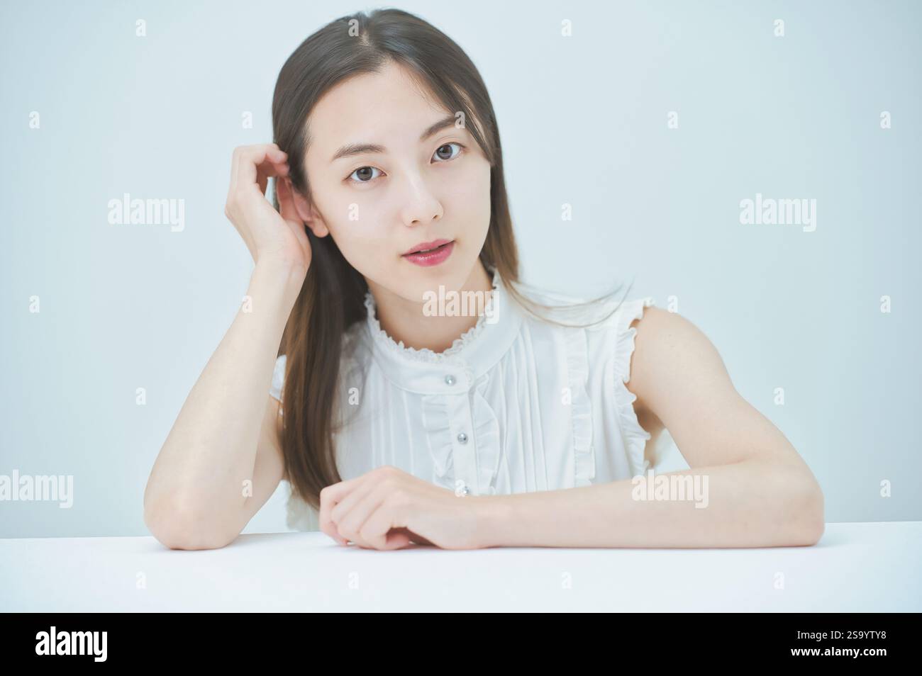 Young woman in elbow pose Stock Photo - Alamy