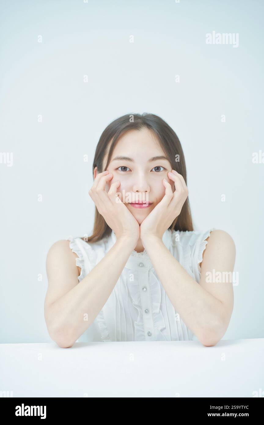 Young woman in elbow pose Stock Photo - Alamy