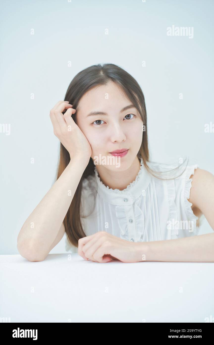 Young woman in elbow pose Stock Photo - Alamy