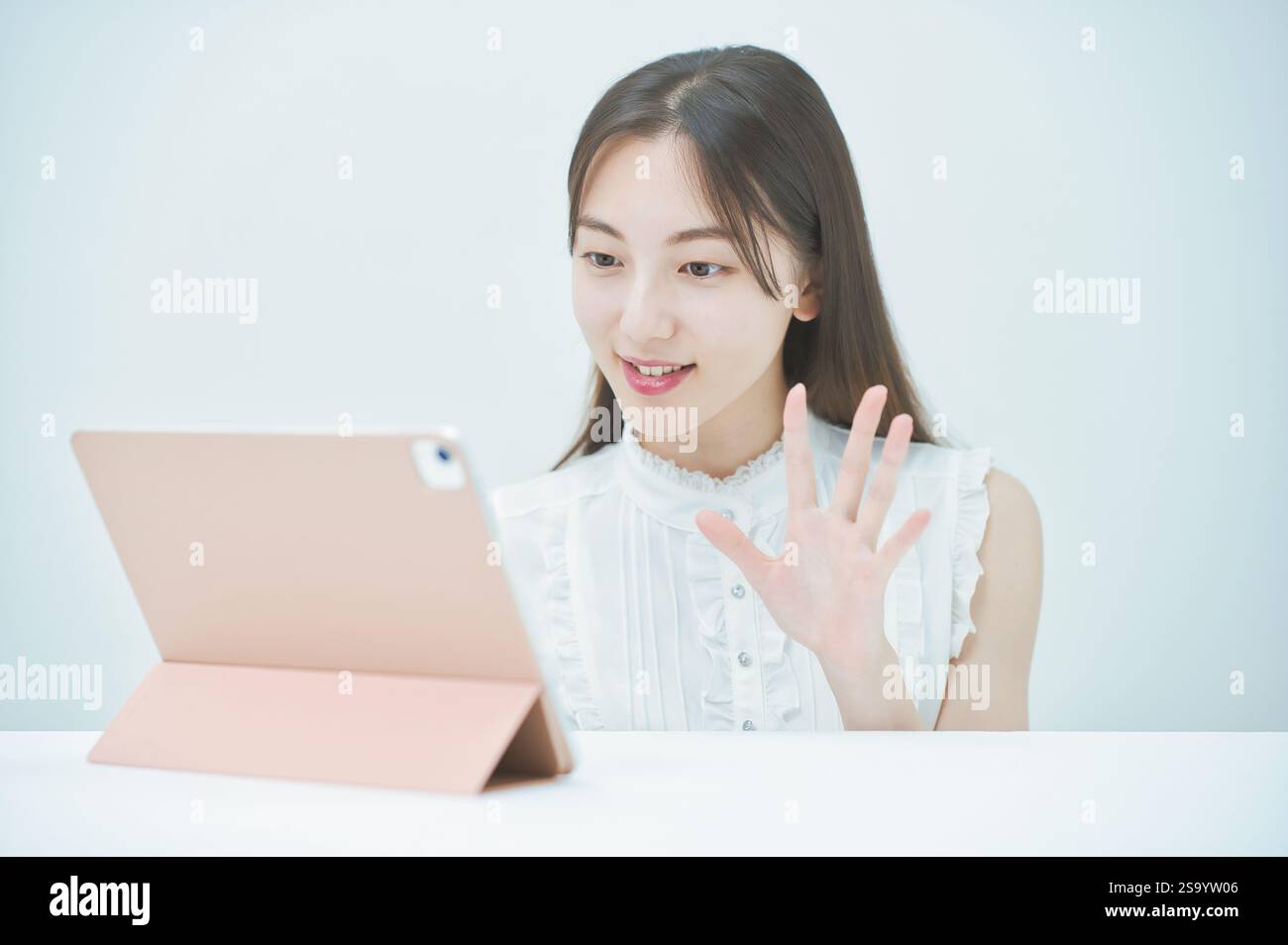 Woman communicating online using a tablet PC Stock Photo - Alamy
