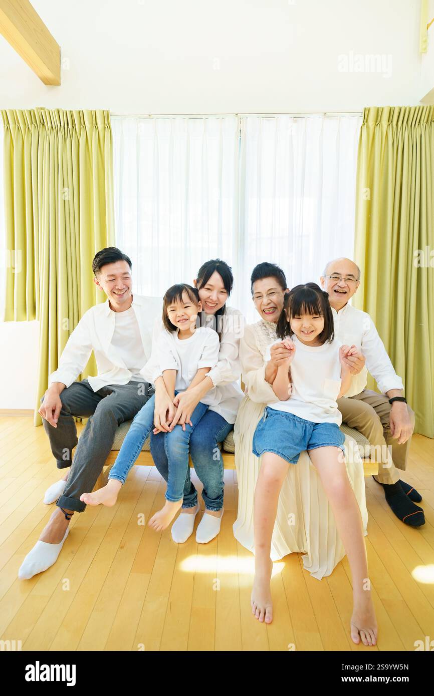 Group photo of a three-generation family Stock Photo - Alamy
