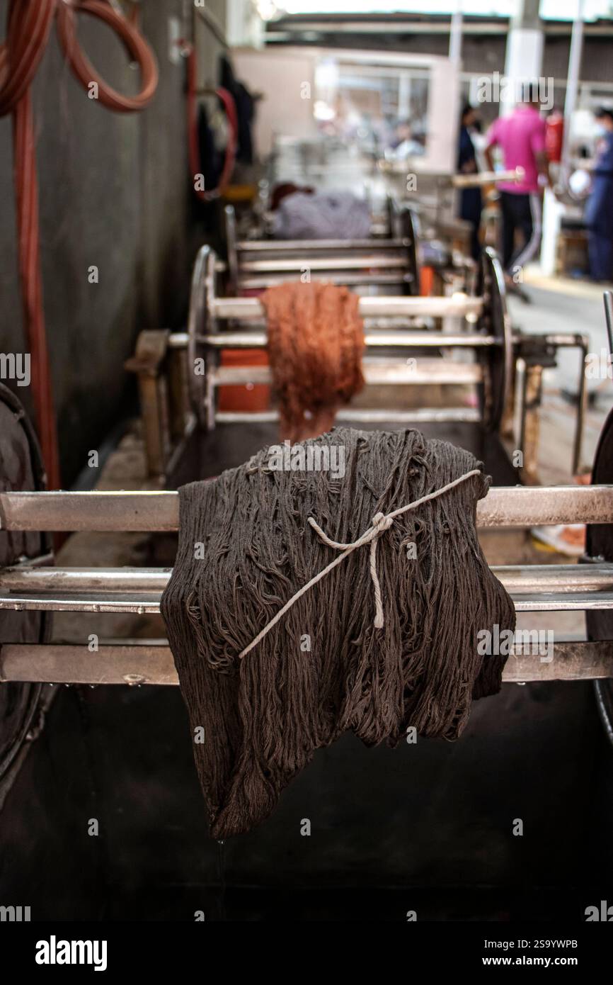 Workers with precision and care, skillfully wrap skeins of yarn around ...