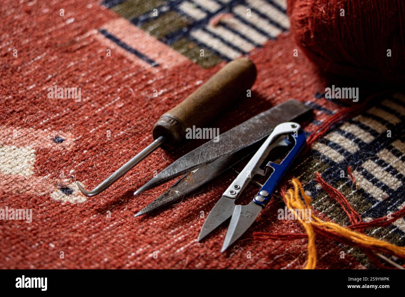 Carpet mending tools at Jorpati, Kathmandu, Nepal Stock Photo - Alamy
