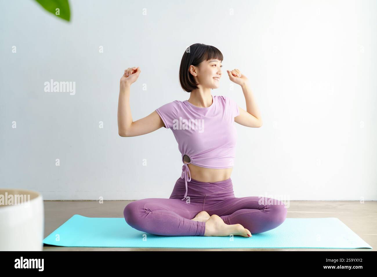 Woman taking deep breaths between yoga poses Stock Photo - Alamy