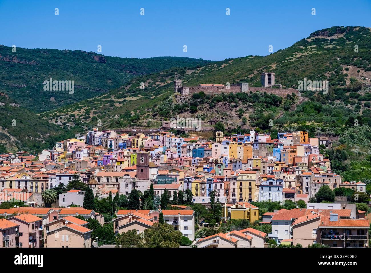 Colourful houses of the small town of Bosa, dominated by the Castello ...