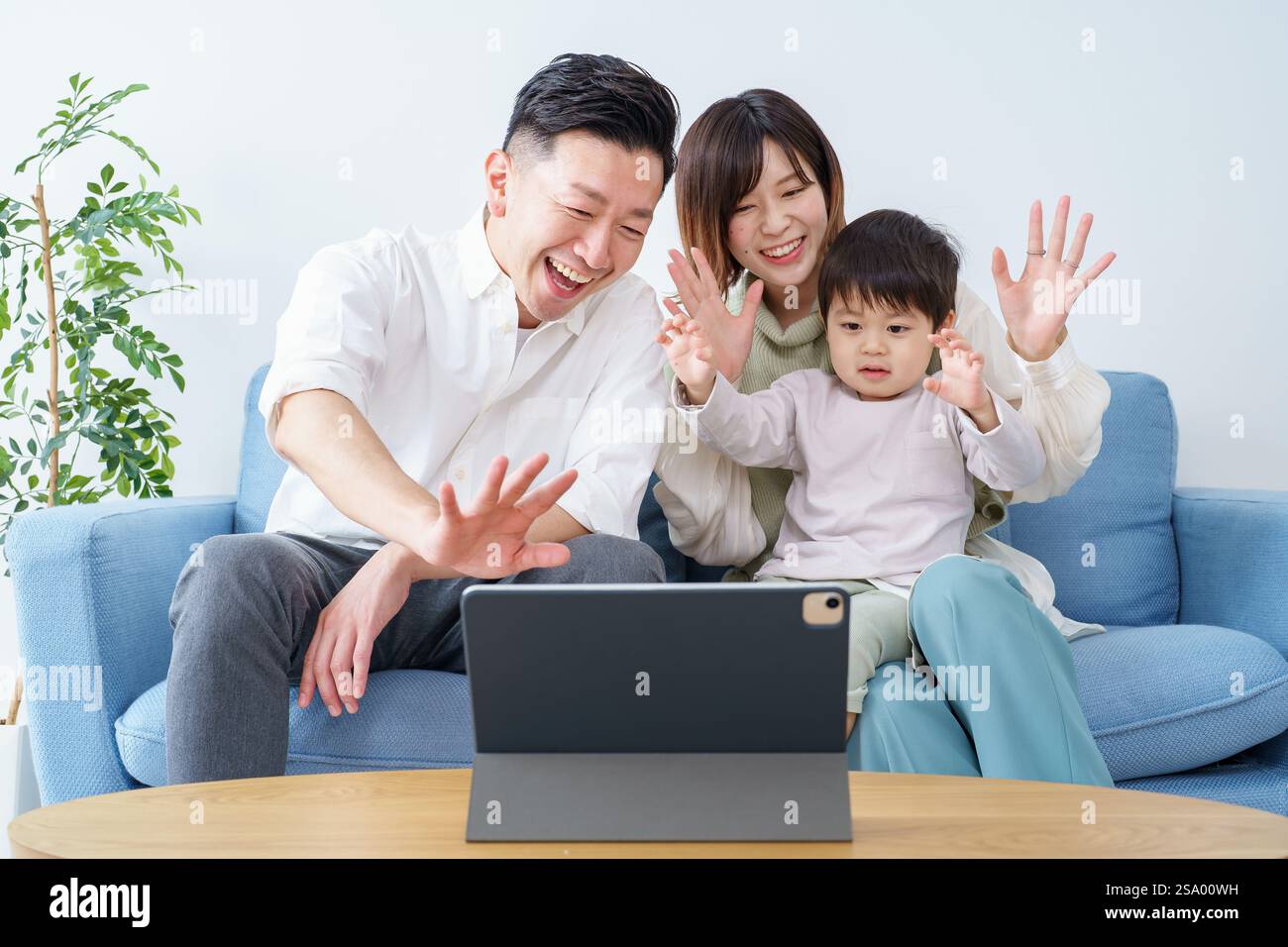 Boy waving from distance hi-res stock photography and images - Alamy