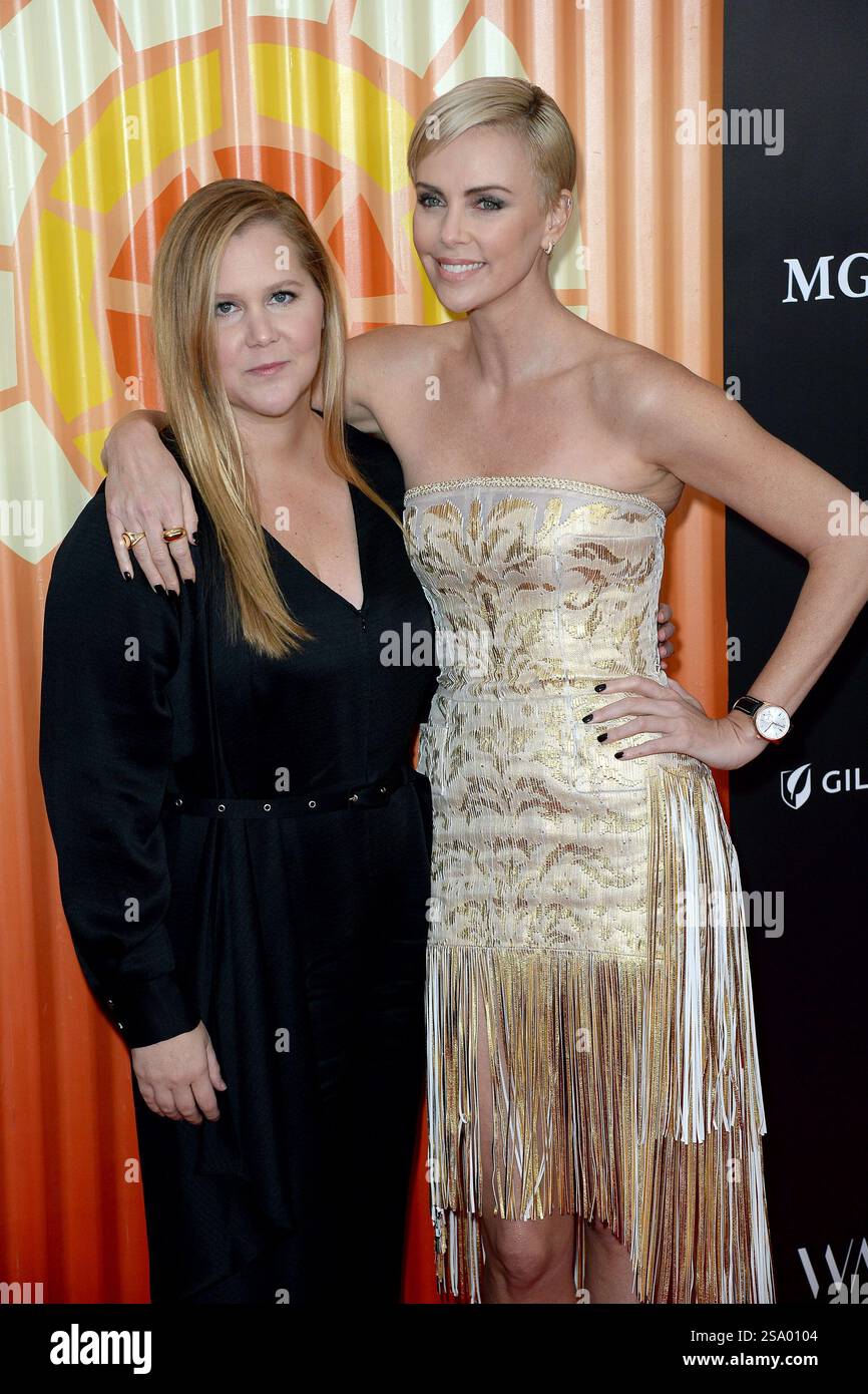 Amy Schumer and Charlize Theron attending Charlize Theron's Africa ...