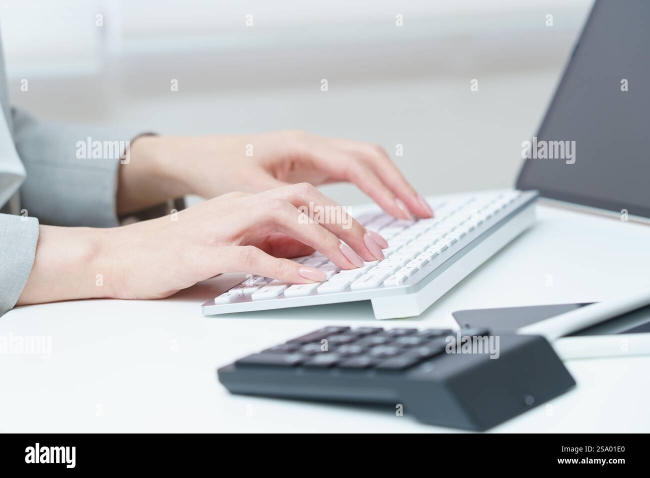 Woman's hand on computer keyboard Stock Photo - Alamy