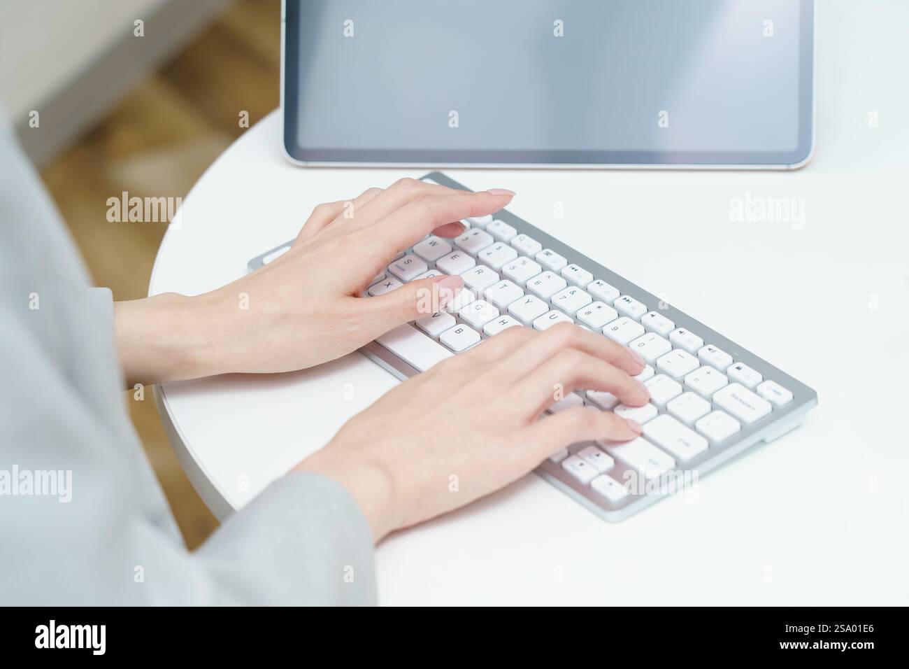 Woman's hand on computer keyboard Stock Photo - Alamy