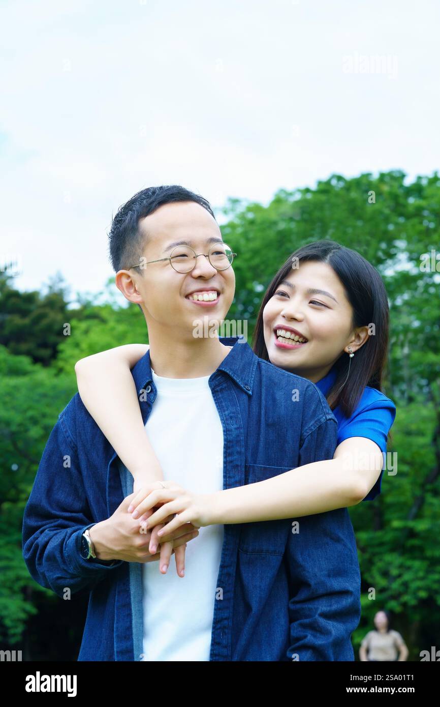 Couple smiling and hugging each other Stock Photo - Alamy