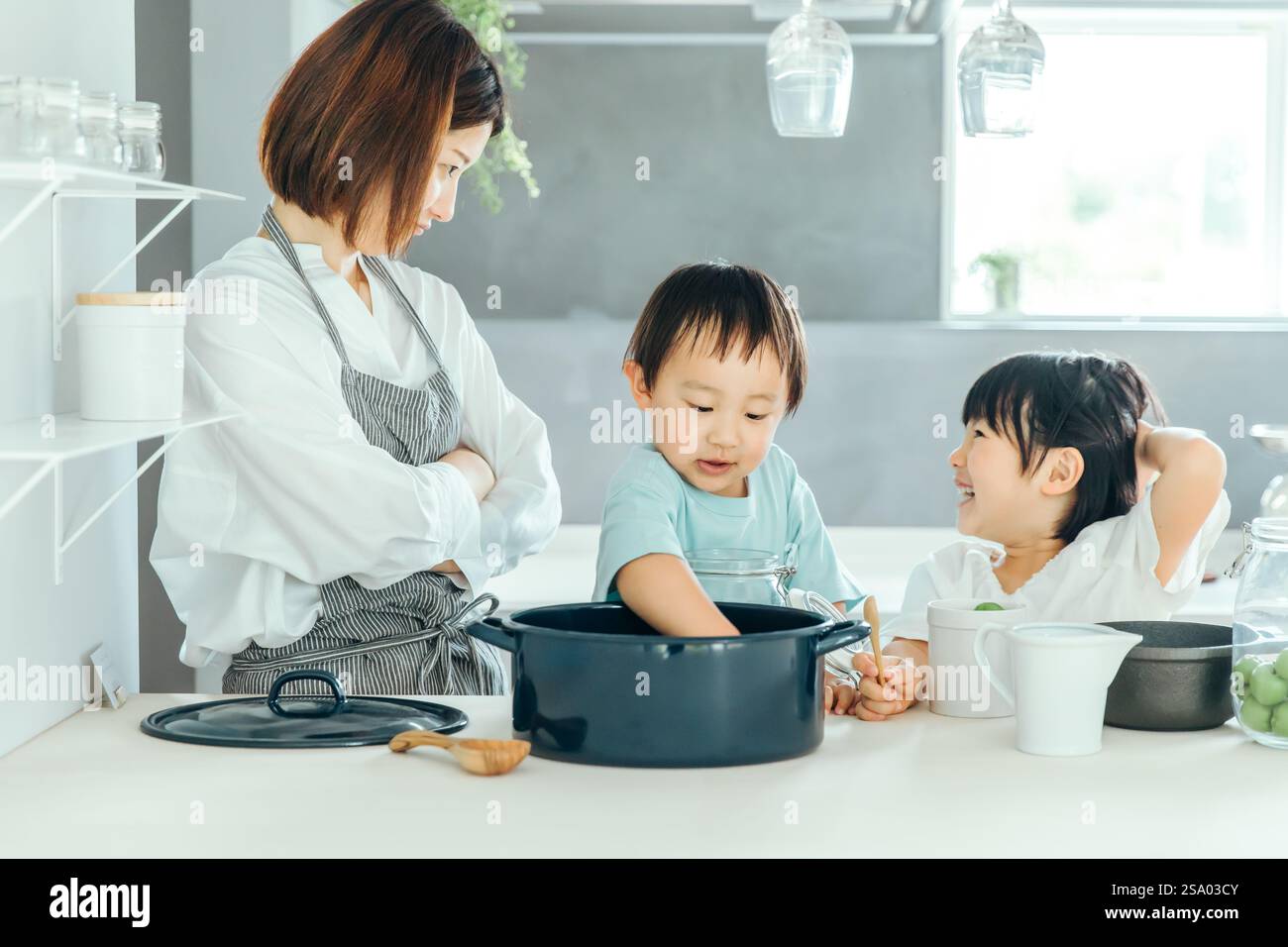 Children helping their mothers Stock Photo - Alamy