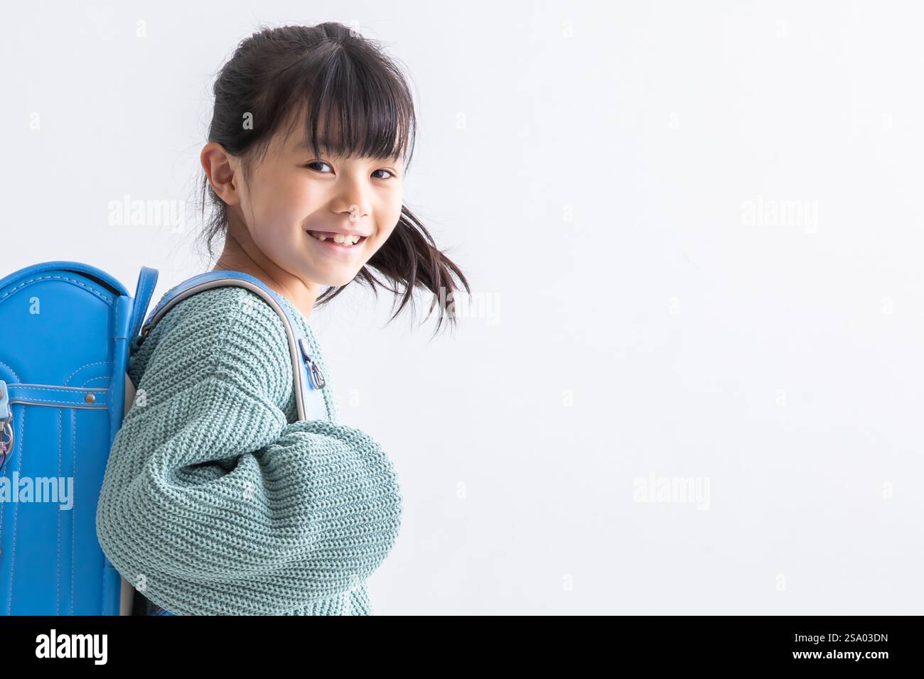 Schoolchildren looking back with big smiles Stock Photo - Alamy