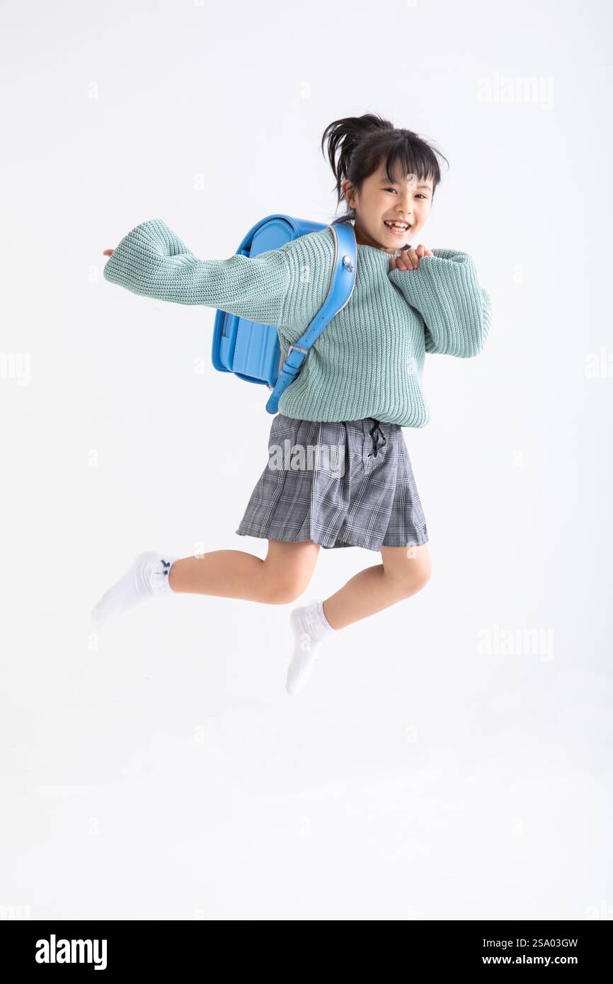 Primary school children jumping Stock Photo - Alamy