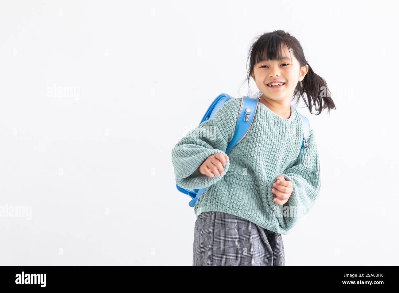 Primary school children looking back with smiles Stock Photo - Alamy