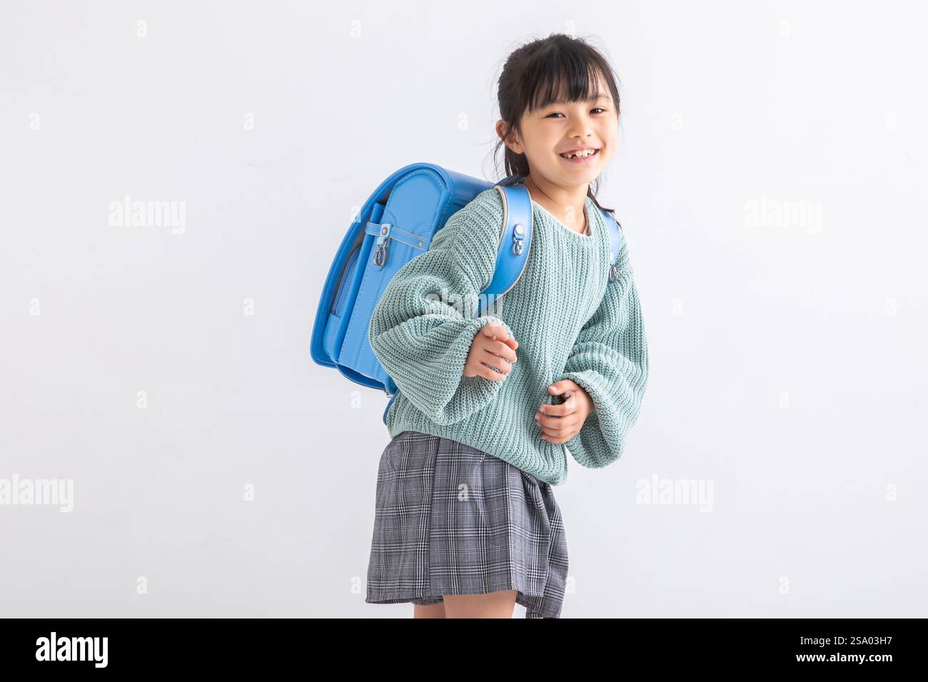 Primary school children looking back with smiles Stock Photo - Alamy