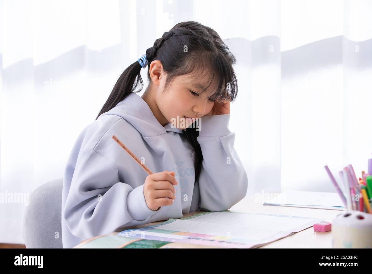 Child struggling to solve a problem Stock Photo - Alamy