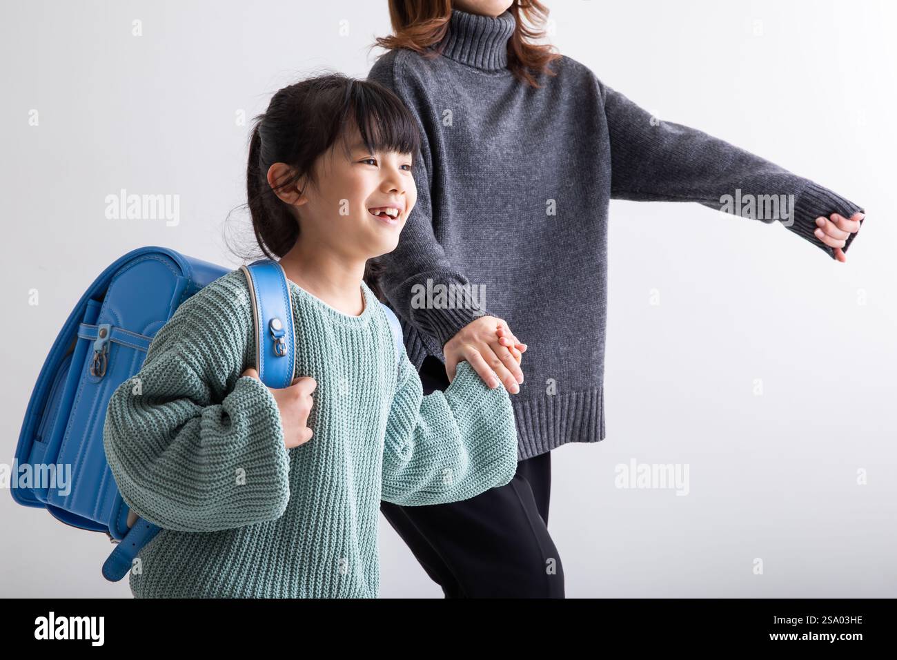 Primary school children walking hand in hand Stock Photo - Alamy