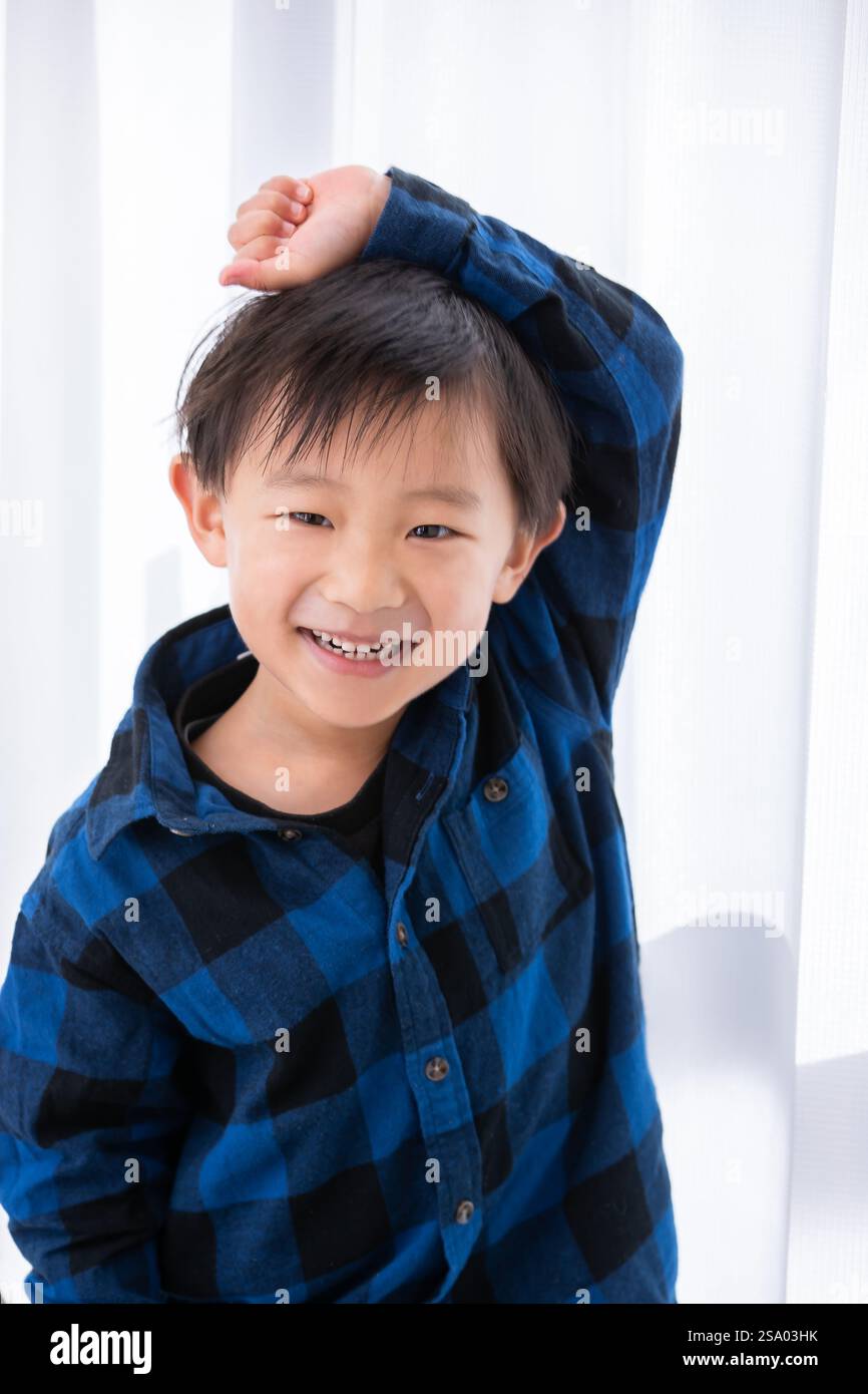Small boy posing with his guts Stock Photo - Alamy