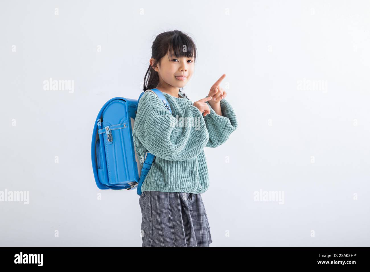 Schoolboy pointing his finger Stock Photo - Alamy